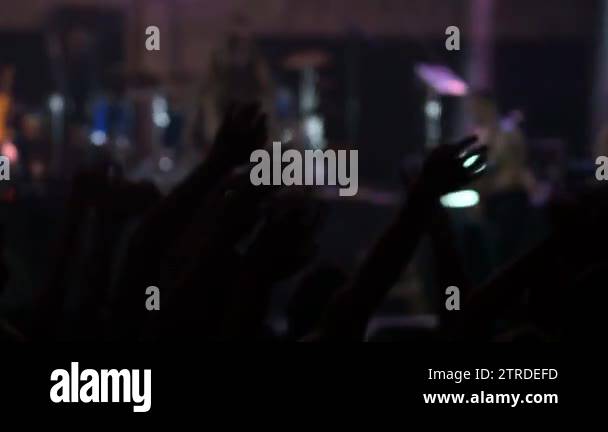 Slow motion big crowd at concert cheering clapping hands. night rock ...