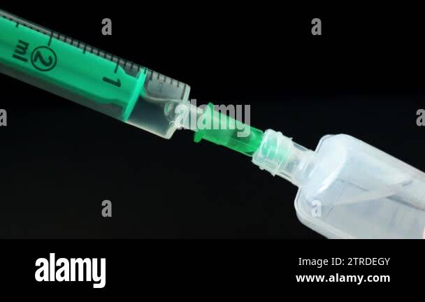 Plastic medical syringe with needle and plastic vial. Medical injection ...