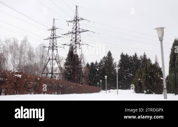 two TRANSMISSION LINE power transmission line in a park with lanterns ...