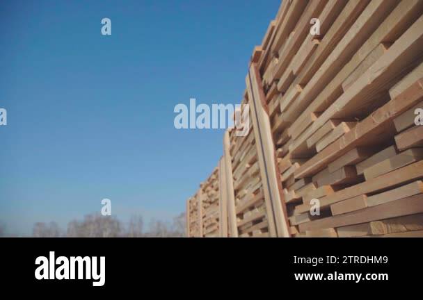 Wooden beams and boards neatly stacked in a pyramid shape Stock Video ...