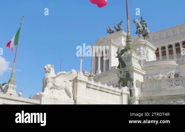 Italian national flags near white marble Altare della Patria monument ...