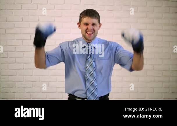 Businessman with boxing gloves celebrating the victory. Man in boxing ...