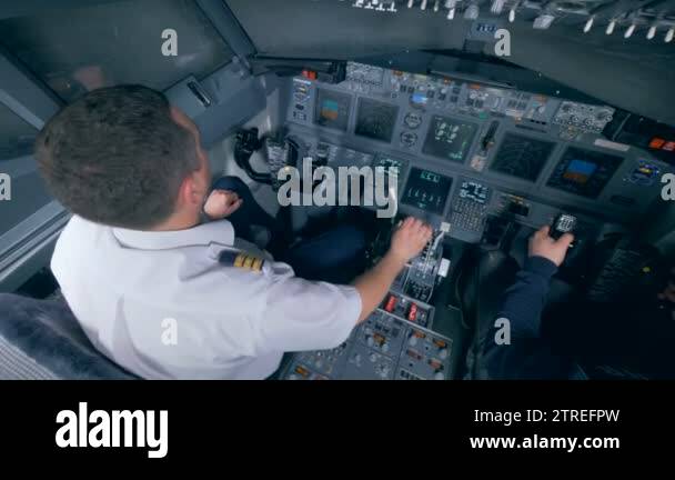 Aircraft flying process performed by two men in a cockpit Stock Video ...