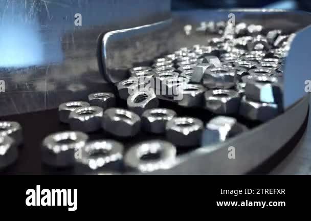 Process of production of nuts, screws. Industrial concept. Factory ...