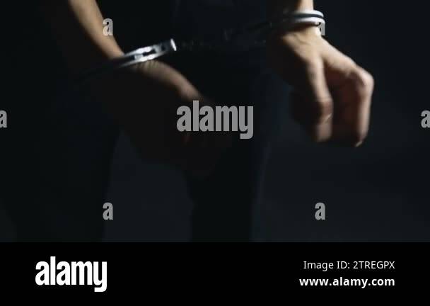 Handcuffed hands man Stock Videos & Footage - HD and 4K Video Clips - Alamy