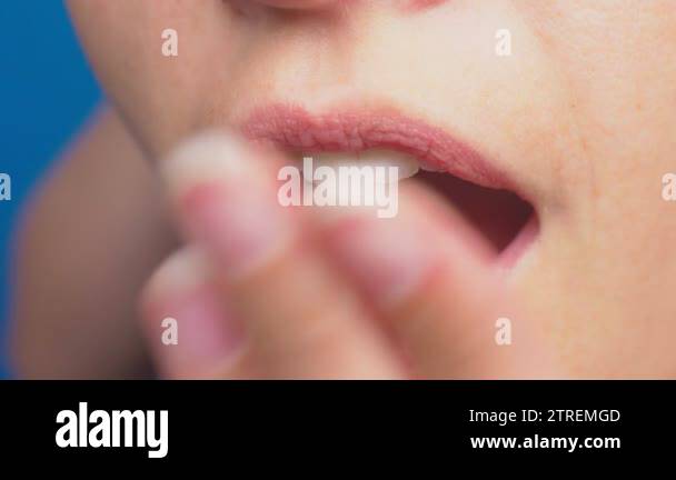 close-up, female lips without makeup, on a blue background. 4k, slow ...