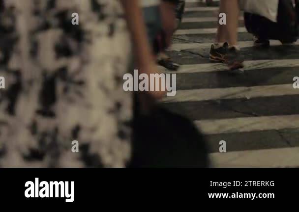 NEW YORK, USA - SEPTEMBER 28: Human legs walking on pedestrian crossing ...