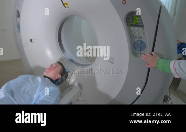 Patient in a Emergency hospital MRI scanner. Man lays in Magnetic ...