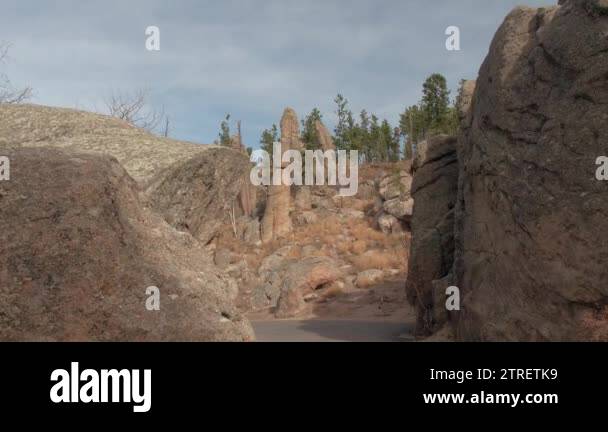 FPV, CLOSE UP: Driving on scenic steep curvy mountain pass road on ...