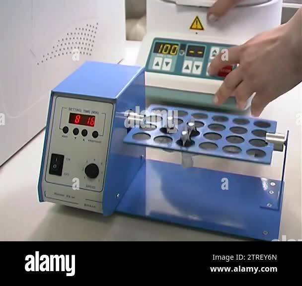 Female research scientist loading centrifuge Stock Videos & Footage ...