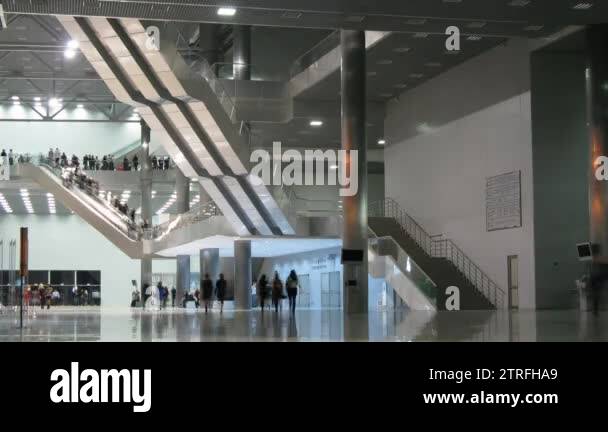 People walk in enormous silver hall with big stairs Stock Video Footage ...