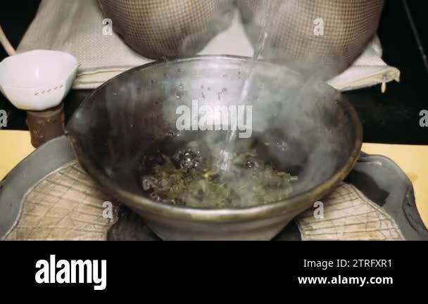the brewed tea leaves during the tea ceremony.Brewing tea in the style ...