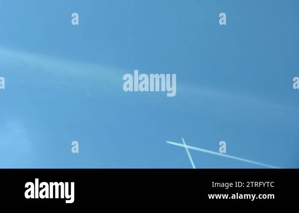 Blue sky with contrails crossing Stock Videos & Footage - HD and 4K ...