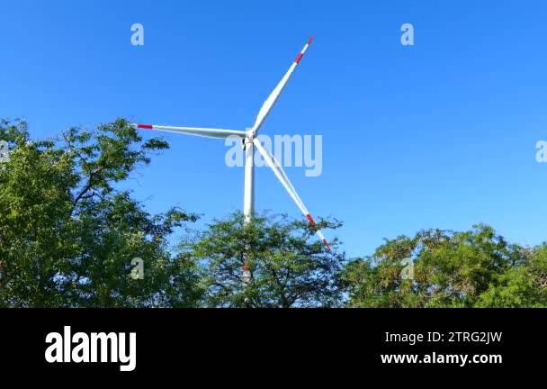 Wind power station. Wind turbine in operation. Green alternative energy ...