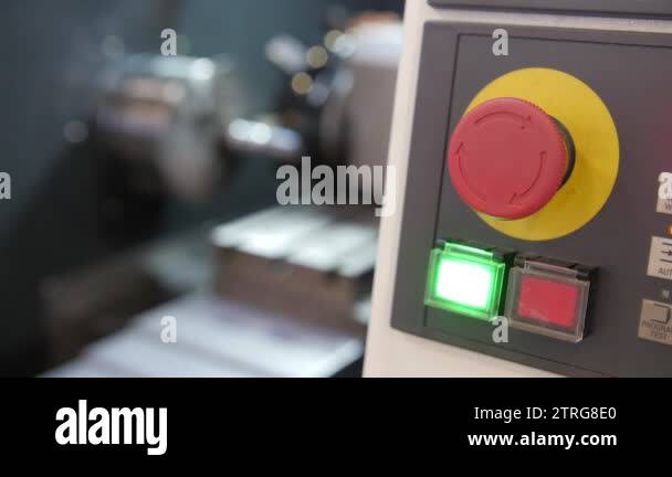 Red button of control panel machine processing of metal, industrial ...