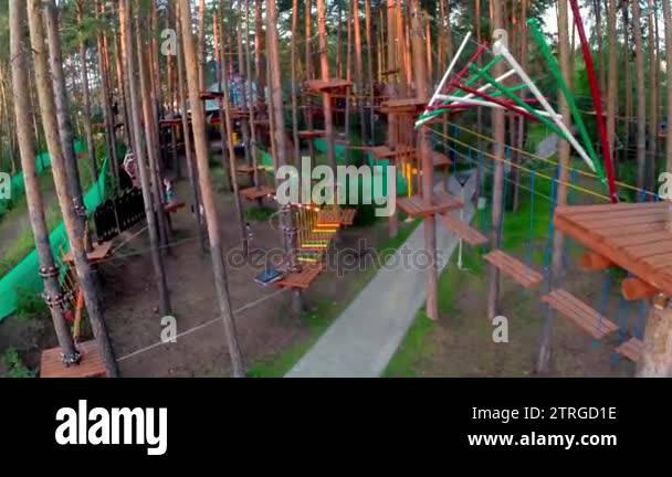 Rope park in the park - knot of rope. high ropes course in forest ...