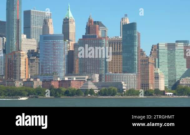 Iconic view of Lower Manhattan business district skyline from the vantage point on Hudson River ...