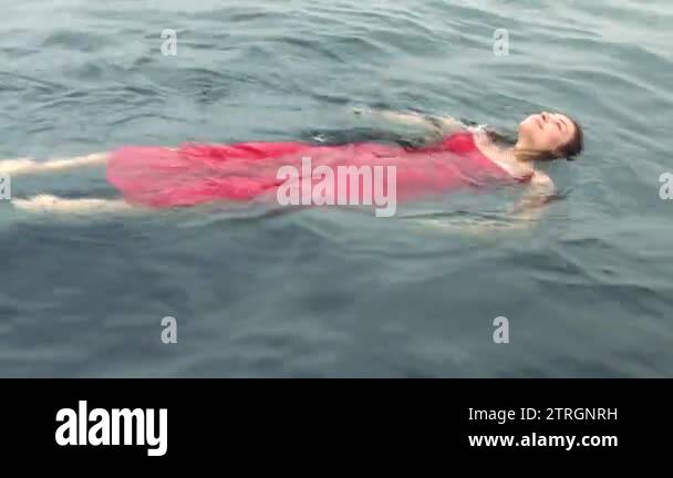 Free diver model in a red dress in water in Red Sea Stock Video Footage ...