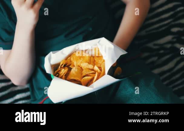 Boy Eating Packet Of Potato Chips unhealthy food Stock Video Footage ...