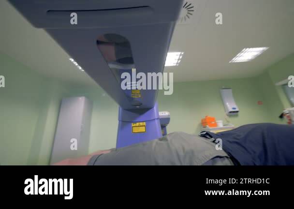 Scanning process of a male patient carried out by an MRI machine Stock ...