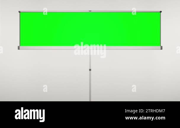 Projection cinema screen pull-down and camera zoom to green screen ...