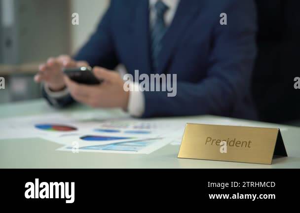 President of corporation working with investment project diagrams ...