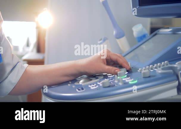 Ladys hand is manipulating a supersonic console in a close up Stock ...