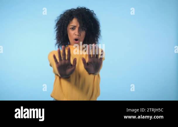 Angry annoyed woman raising hand up to say no stop. Sceptical and ...