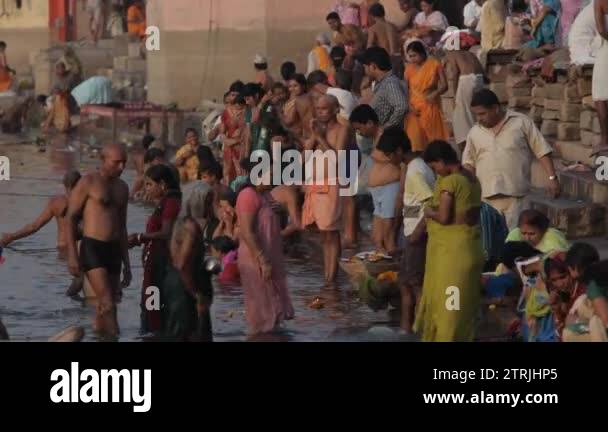 Large group of people bathing in Ganges river Stock Video Footage - Alamy