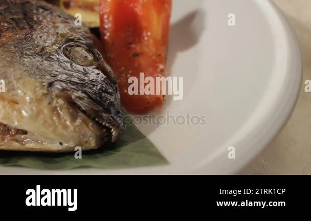 Grilled fish head Stock Videos & Footage - HD and 4K Video Clips - Alamy
