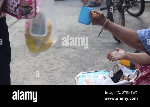 Begging for money Stock Videos & Footage - HD and 4K Video Clips - Alamy