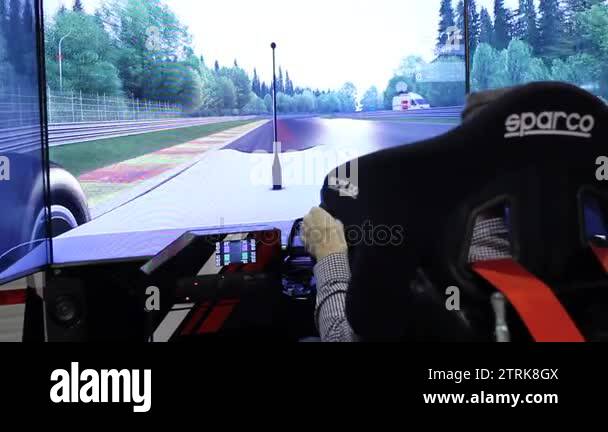 People inside car race simulator Stock Video Footage - Alamy
