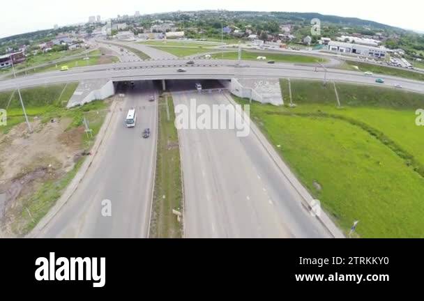 Aerial view of highway in city. Clip. Cars crossing interchange ...