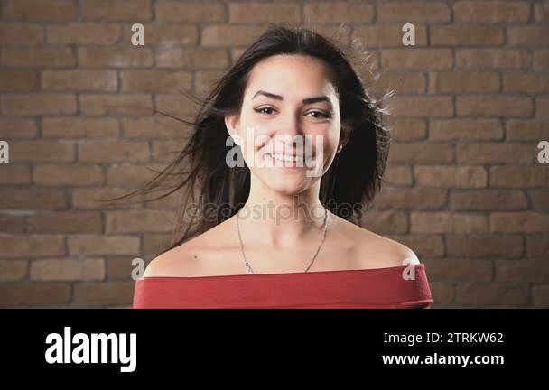 A happy eighteen year old girl, with impressive long loose dark brown ...