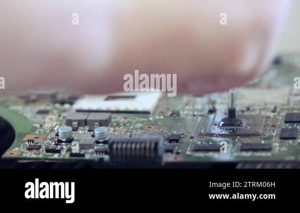 Electronics repair heats up the circuit for remove broken microchip ...
