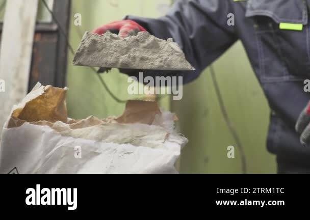 Mixing of a plaster solution by manual method . professional builder ...