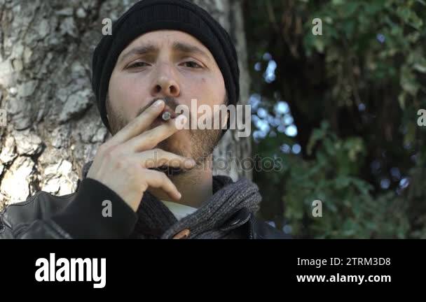 Smoking under a tree Stock Videos & Footage - HD and 4K Video Clips - Alamy