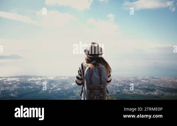 Excited beautiful tourist woman standing near amazing scenery view on ...