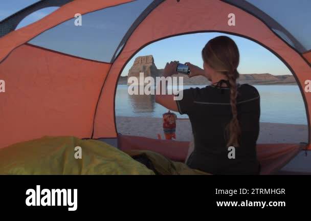Taking Pictures with Phone Tent Camping Lone Rock Lake Powell Stock ...