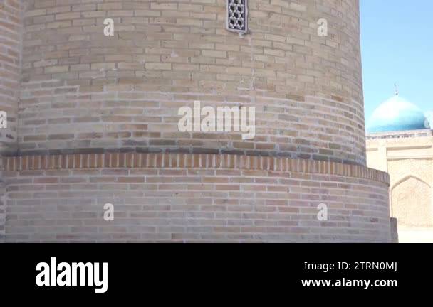 High oval tower of bricks, ancient Asian buildings. the details of the ...