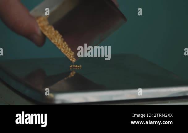 Gold granules Stock Videos & Footage - HD and 4K Video Clips - Alamy