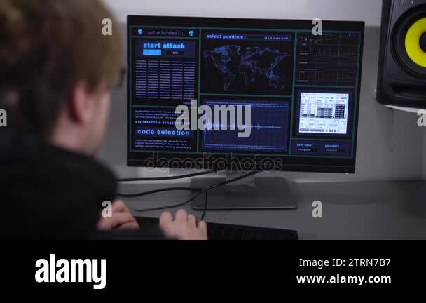 Back view of professinal hacker making cyber attack on network of the ...