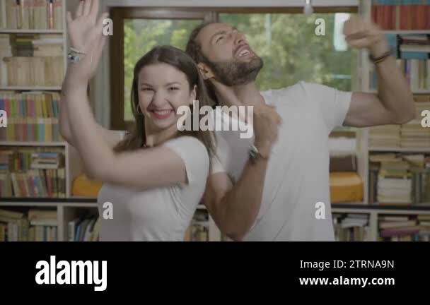 Successful happy millennial couple celebrating the achievement cheering ...