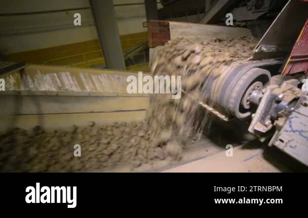 Separation of soil. Grounf, soil going up on conveyor belt at a mining ...