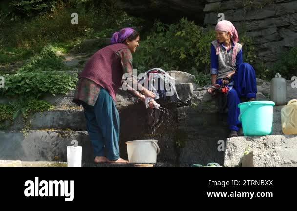 Indian woman washing clothes traditional Stock Videos & Footage - HD ...
