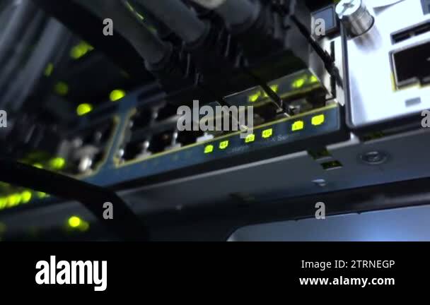 Data center flashing lights. back side of working data servers. router ...