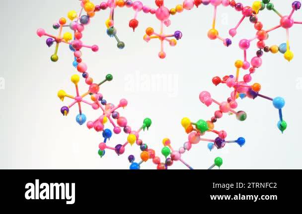 close up color of atom in heart shape are dripping. construction of ...