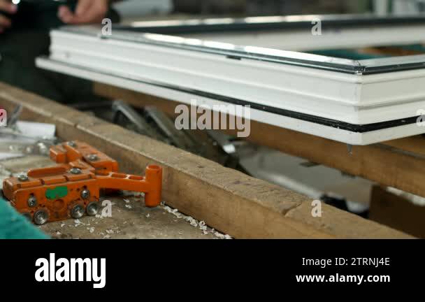 Production and manufacturing of pvc windows, the male worker assembles ...