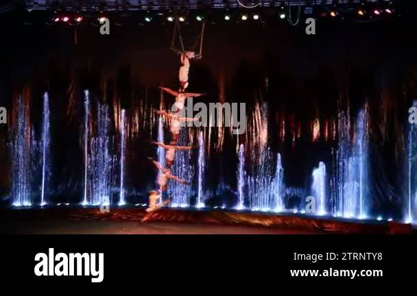 Acrobats with legs open and one acrobat swing from side to side Stock ...