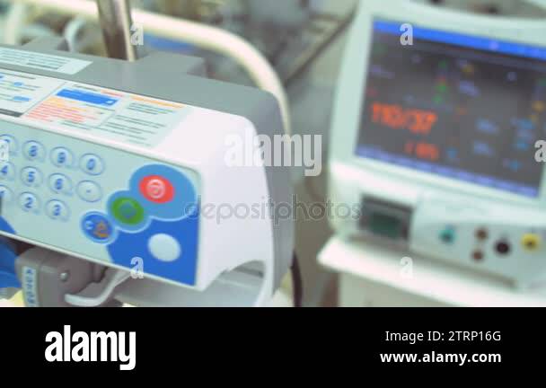 Patient in ICU with ECG monitor and intraaortic balloon ...